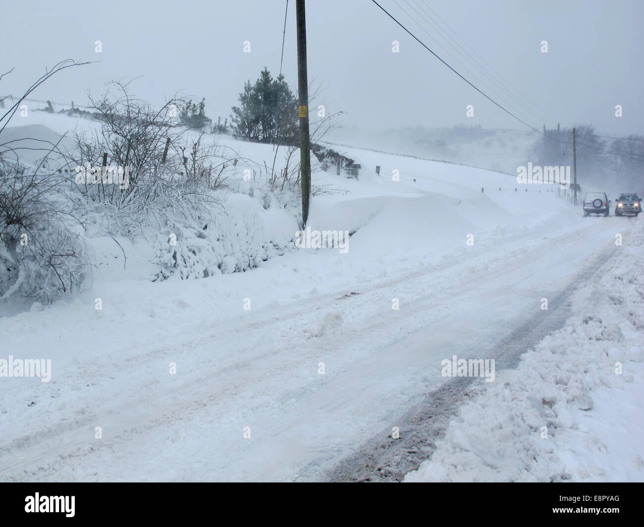 Snow covered road in Rainow after a blizzard, England UK Stock Photo ...