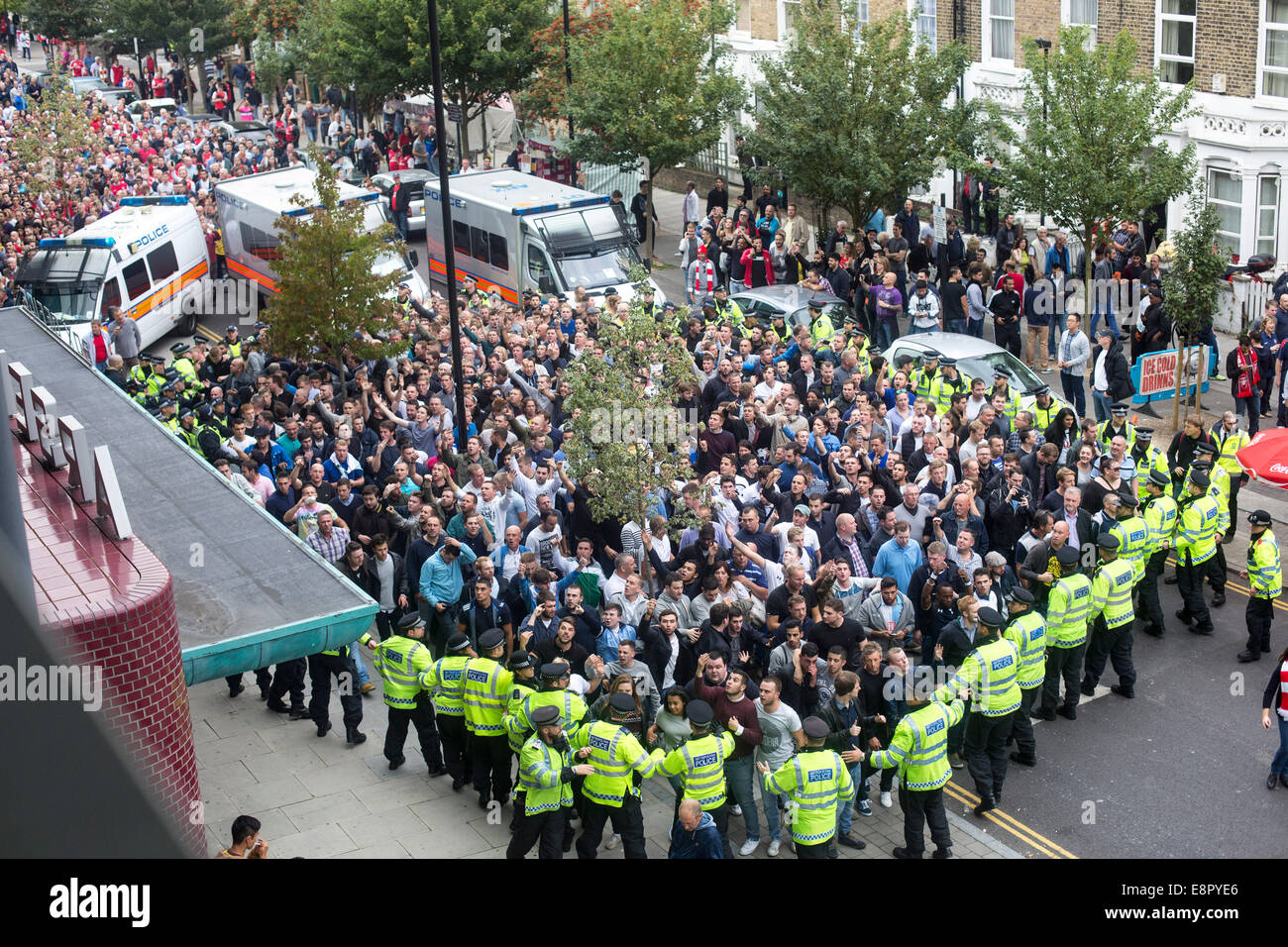 Spurs fans escorted police derby match Arsenal crowd Stock Photo - Alamy