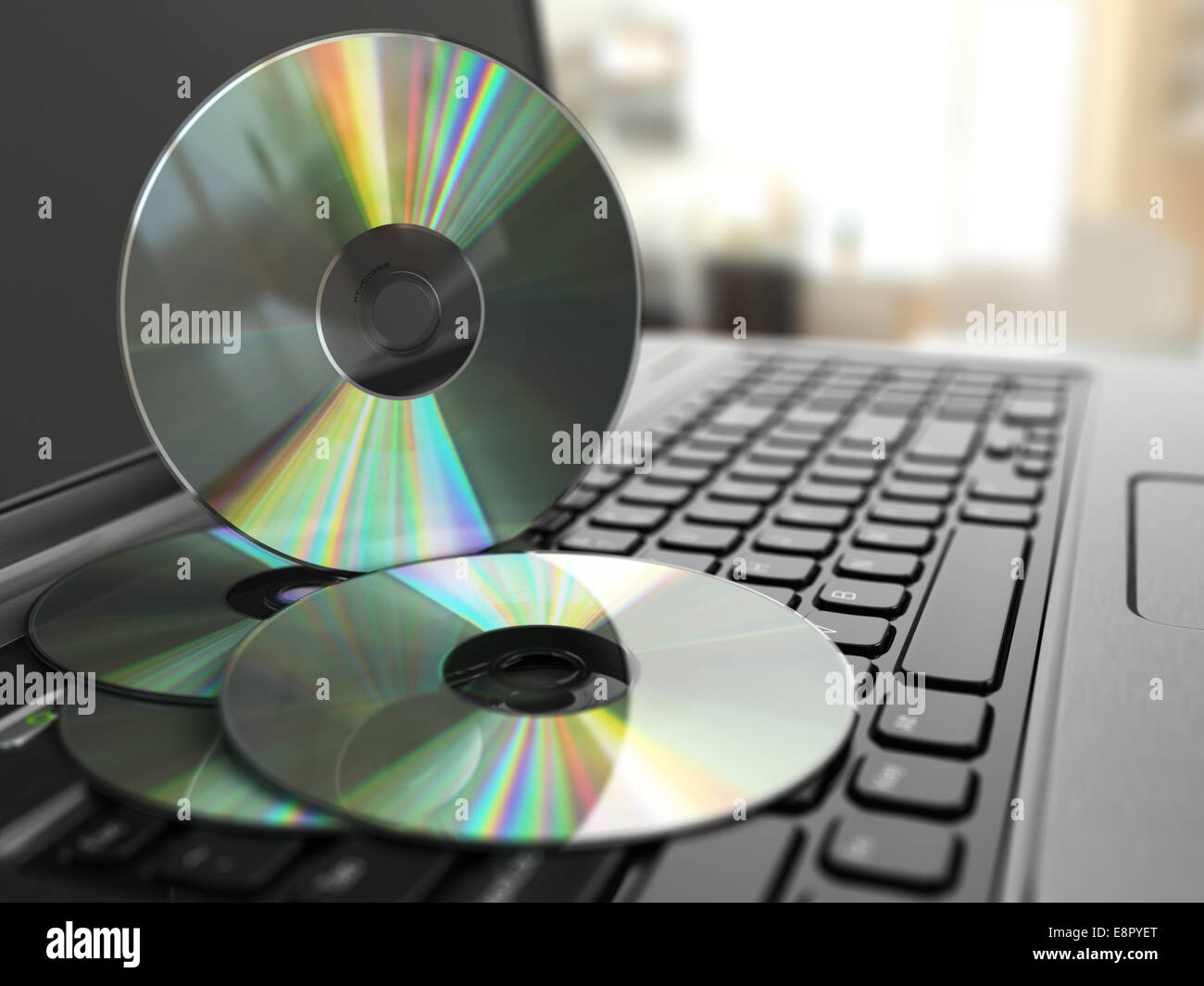 Software CD on laptop keyboard. Compact disks. 3d Stock Photo - Alamy