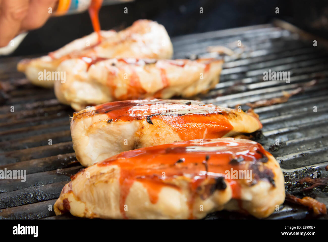 barbeque chicken cooking on the hot outdoor grill Stock Photo - Alamy