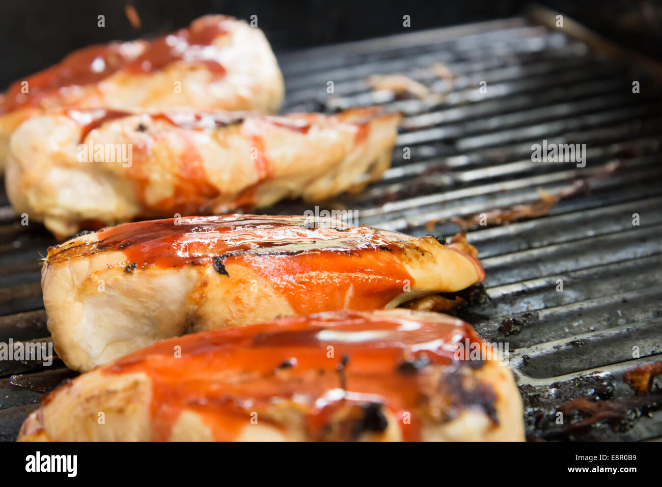 barbeque chicken cooking on the hot outdoor grill Stock Photo - Alamy