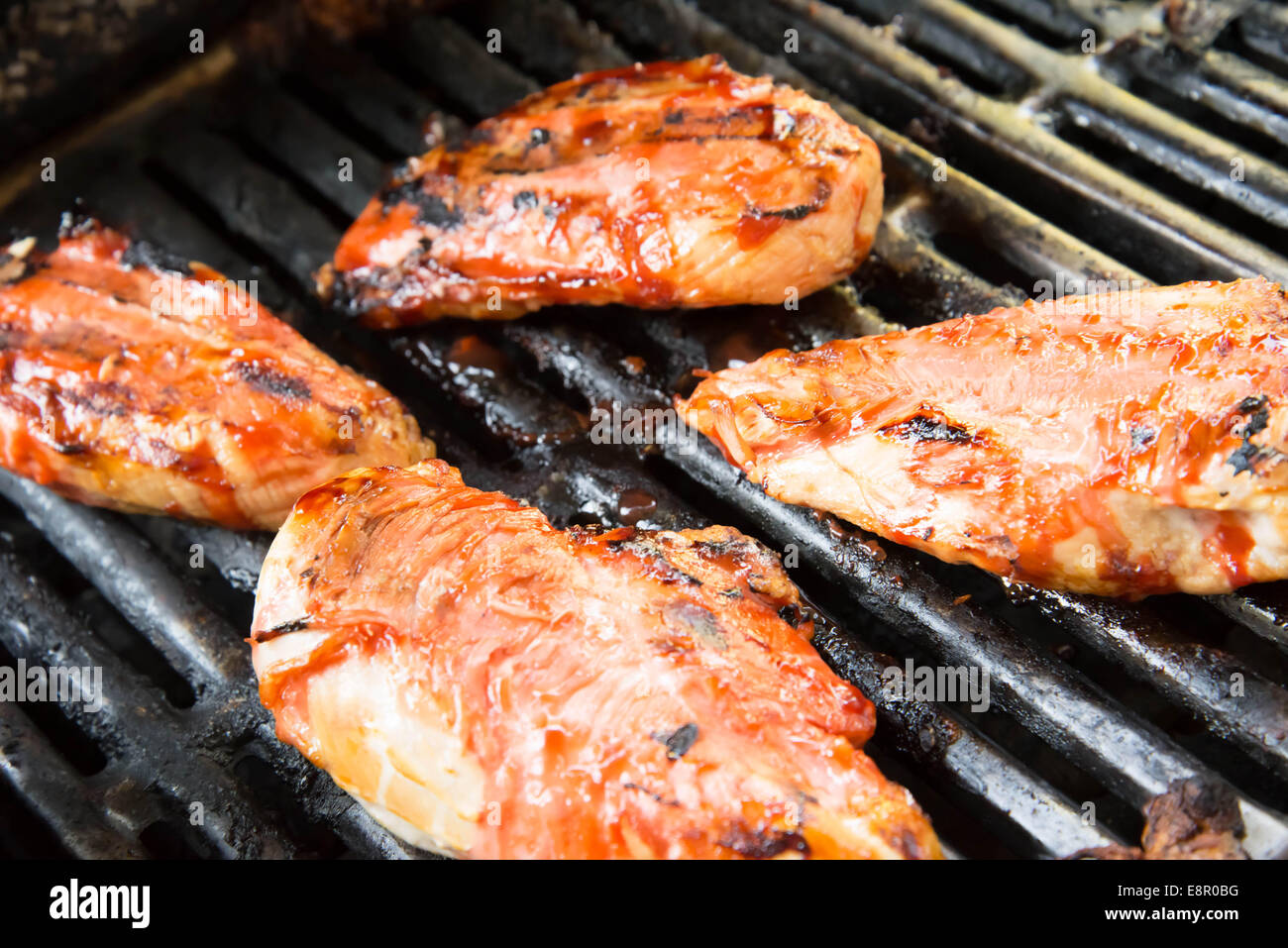 barbeque chicken cooking on the hot outdoor grill Stock Photo - Alamy