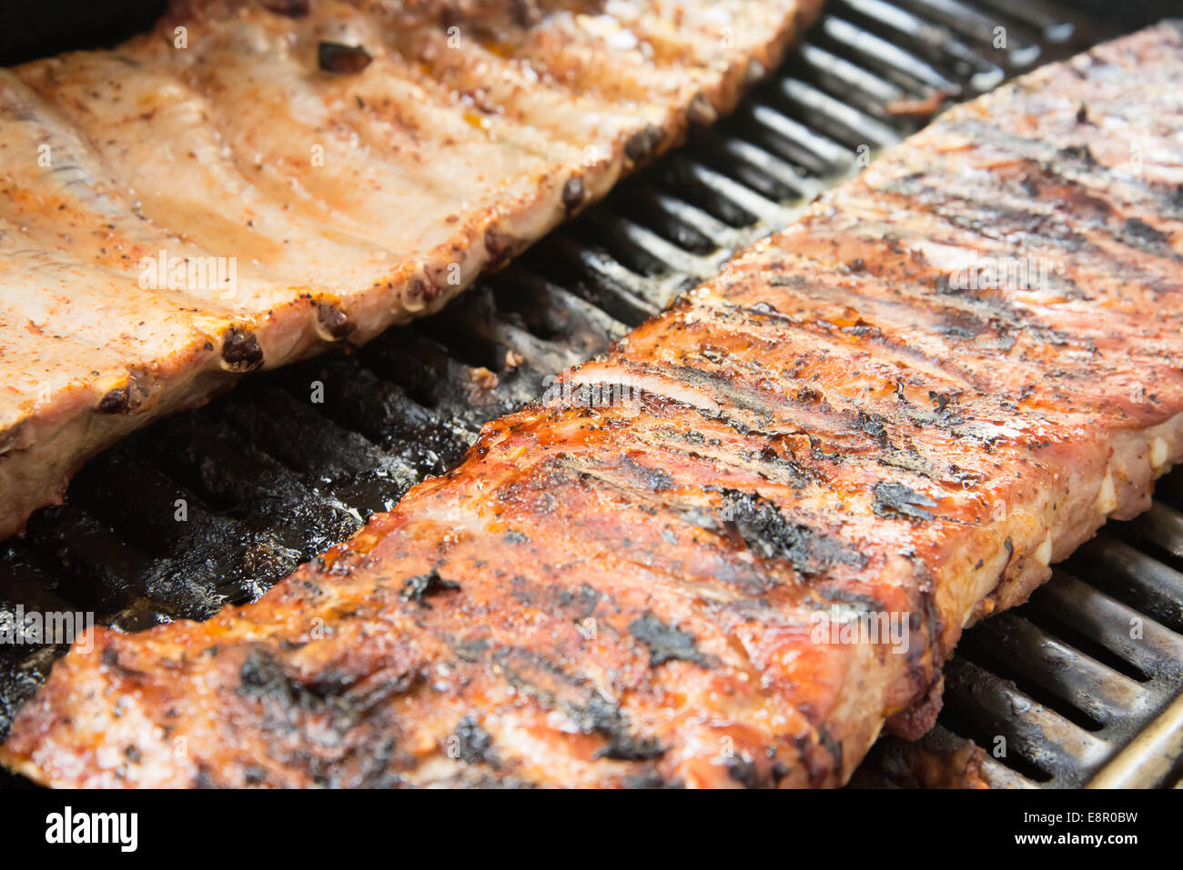 Barbeque ribs cooking on the hot outdoor grill Stock Photo - Alamy