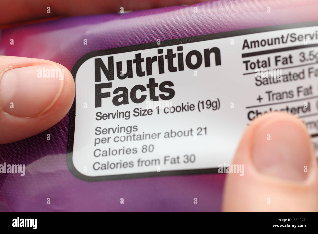 Reading a nutritional facts on cookies packaging. Close-up Stock Photo ...