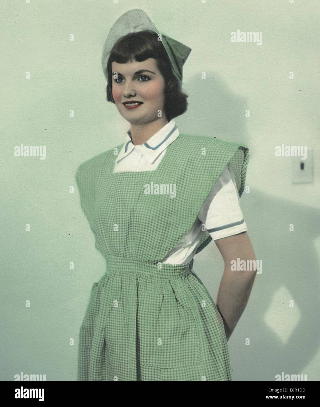Photograph of a nurse wearing a uniform from Colombia. The image is ...