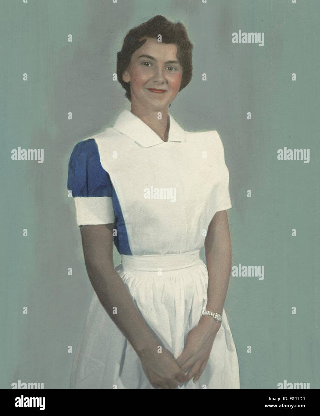 A photograph of a nurse from the Philippines wearing a professional ...