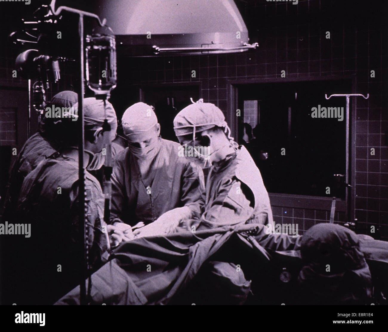 This photo shows a scene from open-heart surgery performed in 1955 ...