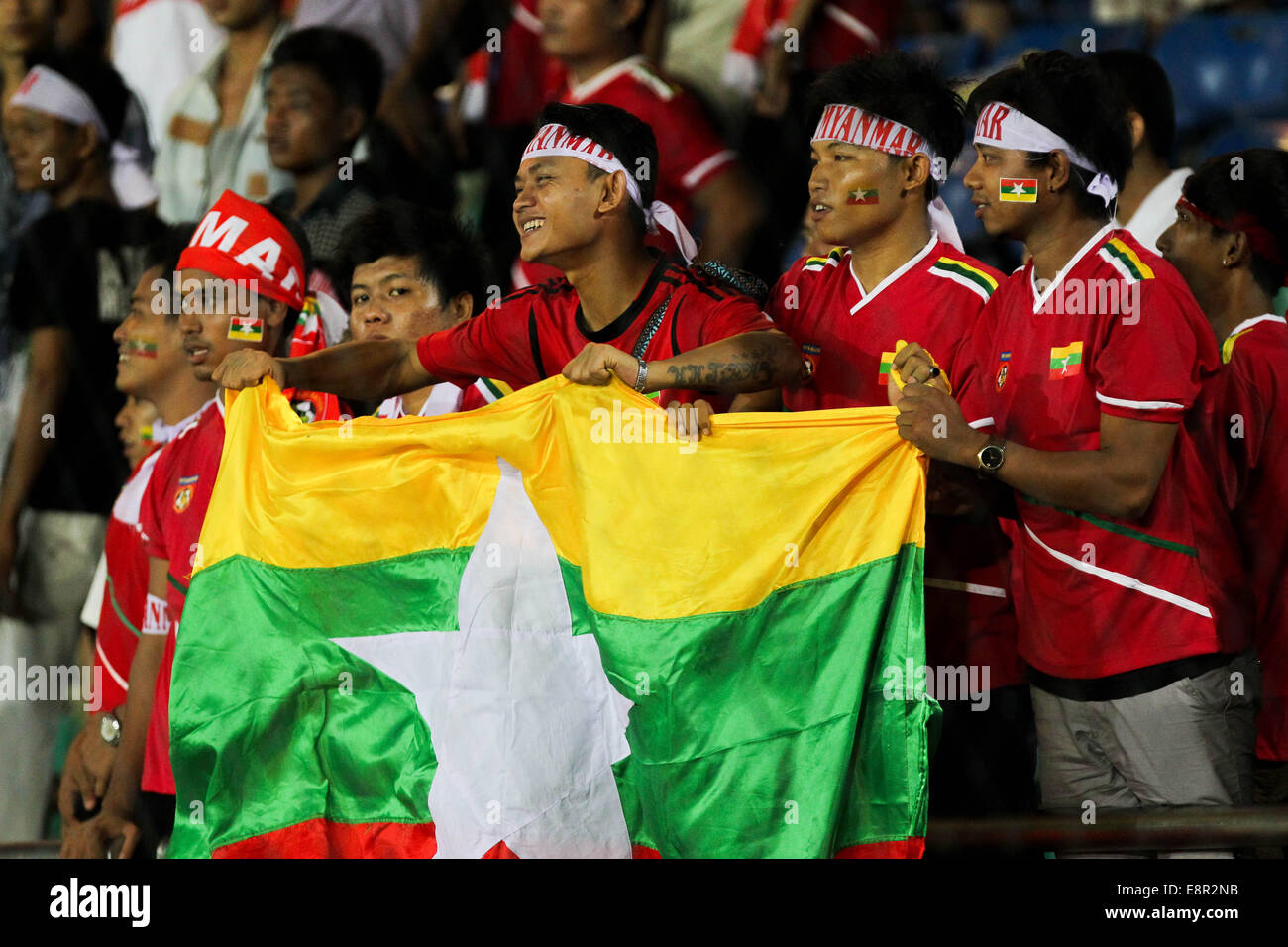 Yangon, Myanmar. 13th Oct, 2014. Fans of Myanmar cheer for their team ...