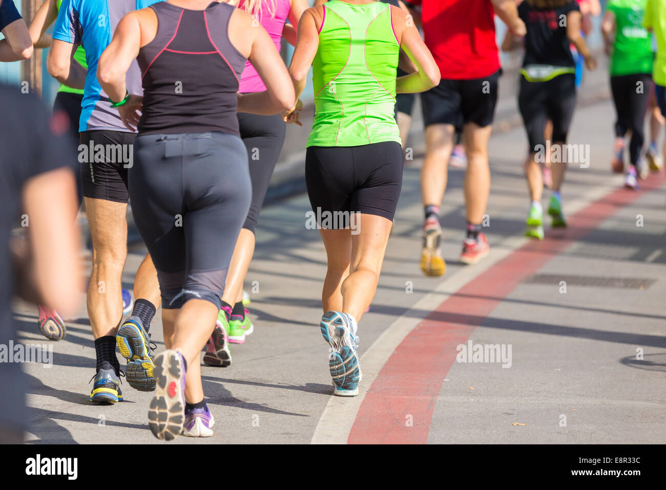 Group of people running Stock Photo - Alamy