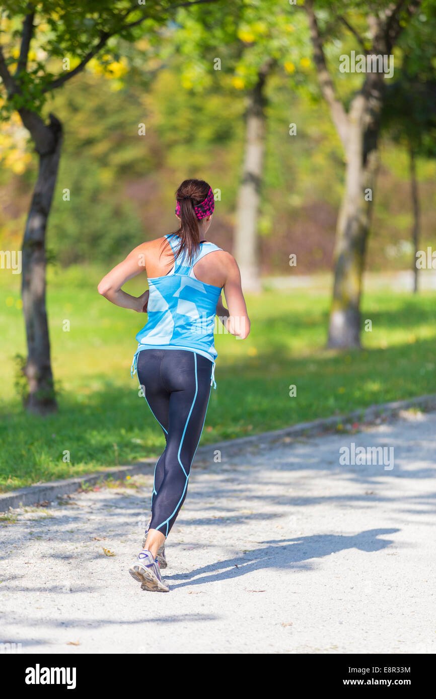 Young girl runner on the street Stock Photo - Alamy