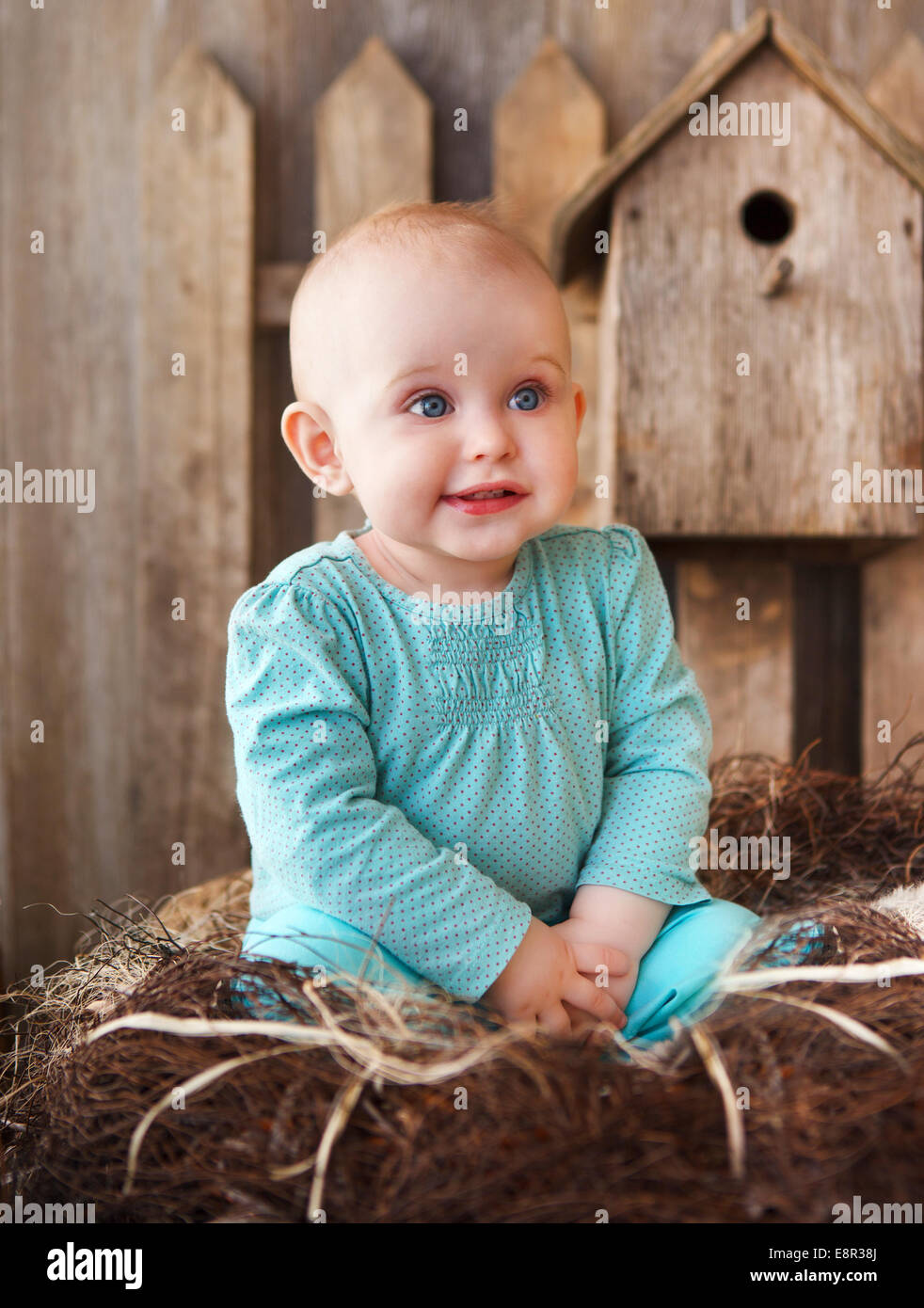Cute smiling ten month old baby on the wooden background Stock Photo ...