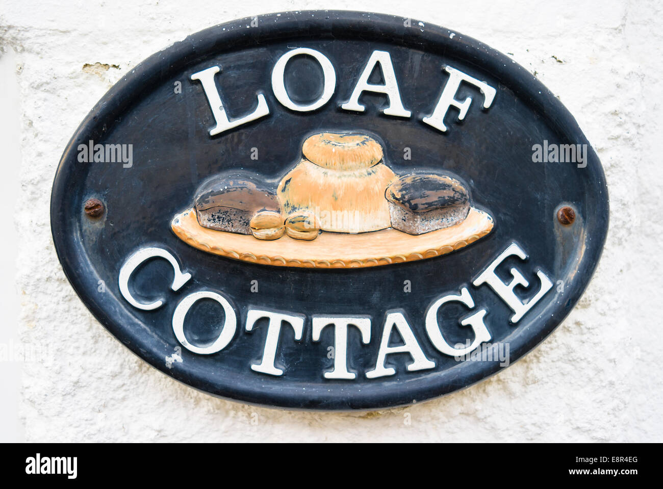 LOAF COTTAGE house sign hinting at previous use of property Stock Photo ...