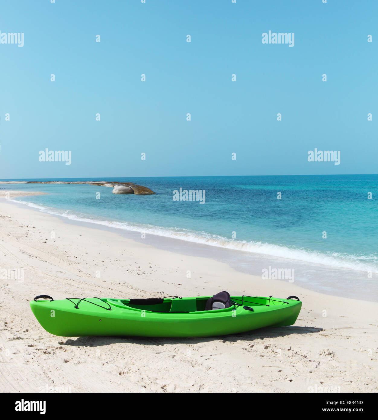 Bright green kayak on the beach Stock Photo - Alamy
