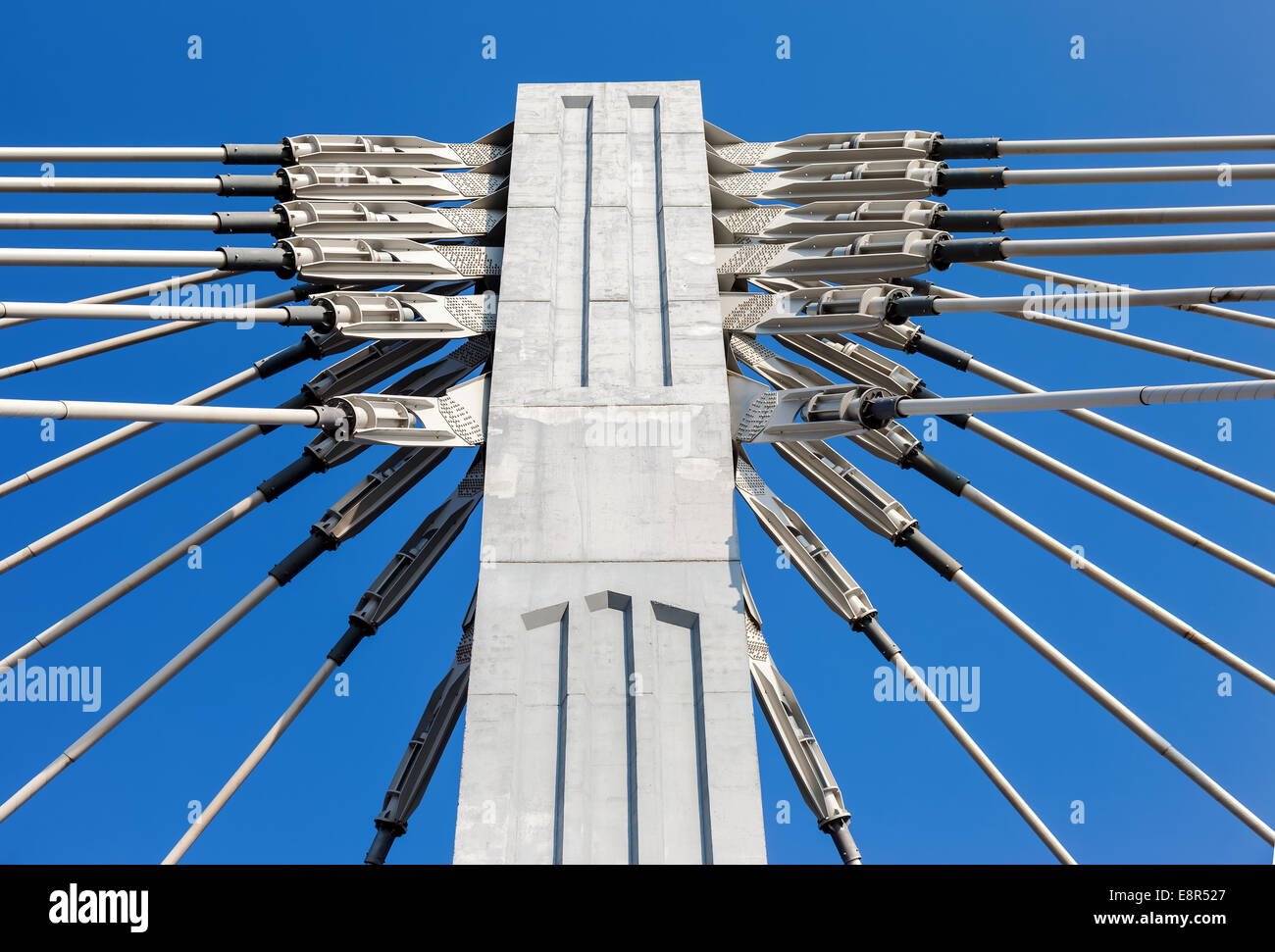 Pillar of cable bridge against blue sky Stock Photo - Alamy