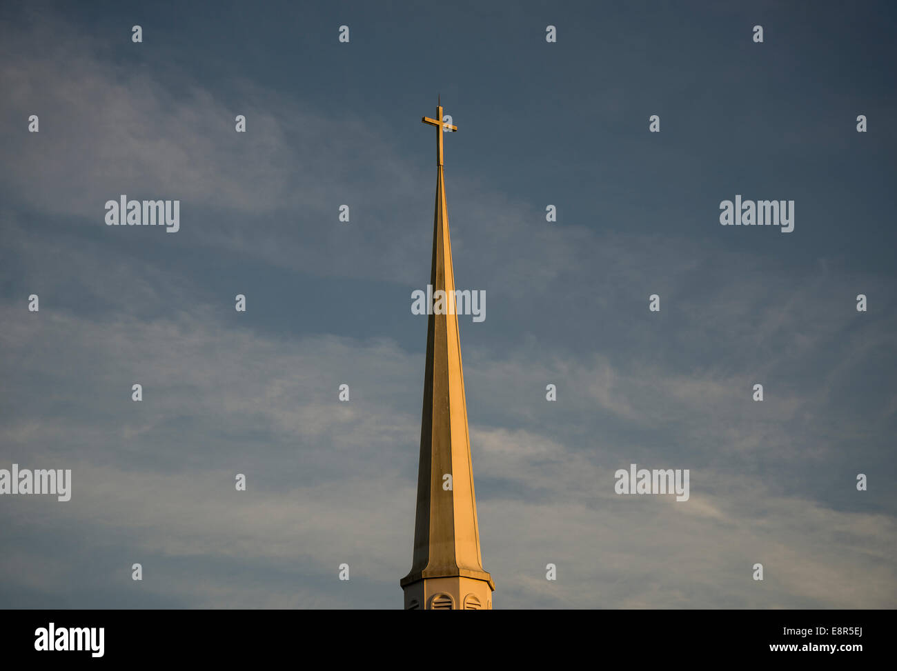 Church steeple in golden sunset colors Stock Photo - Alamy