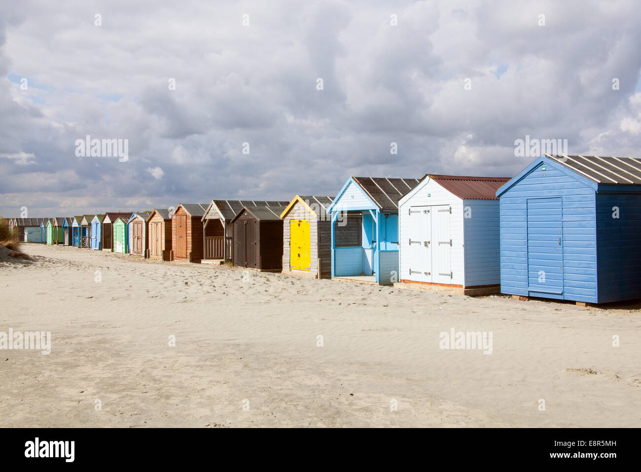 A row of traditional beach huts West Wittering beach Sussex England UK ...