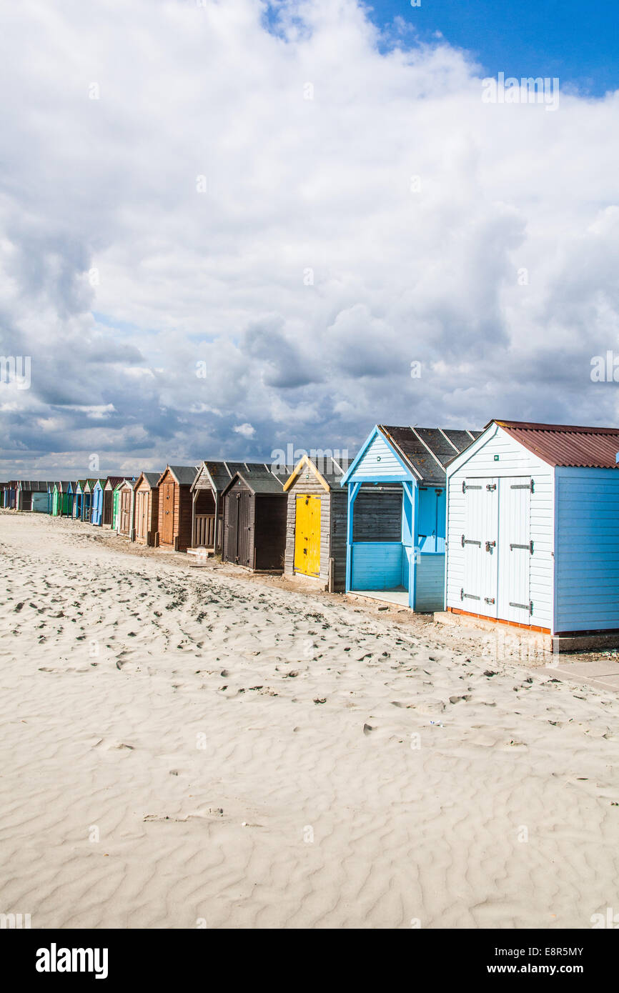 A row of traditional beach huts West Wittering beach Sussex England UK ...