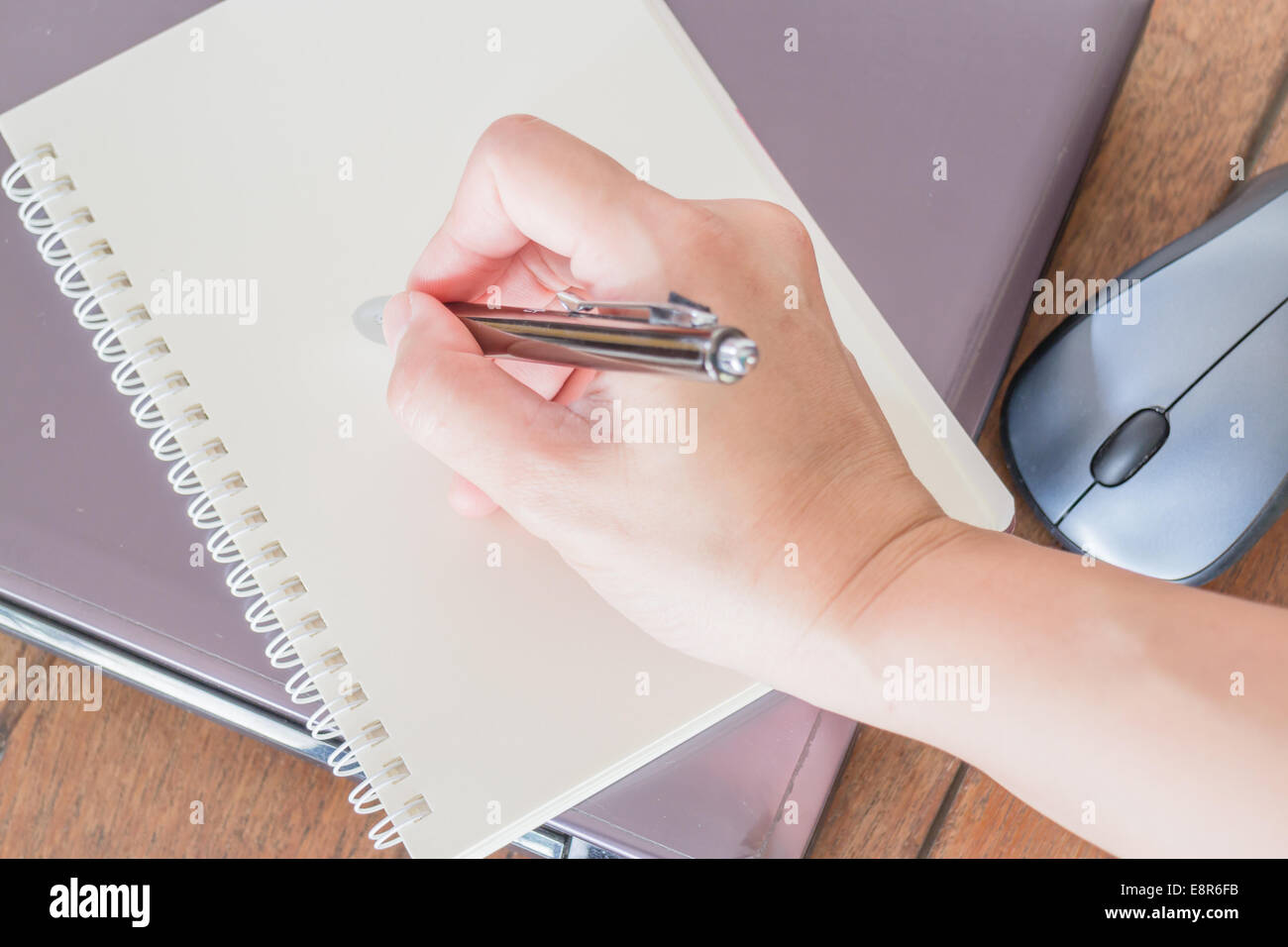 Hand writing on note paper at workplace, stock photo Stock Photo - Alamy
