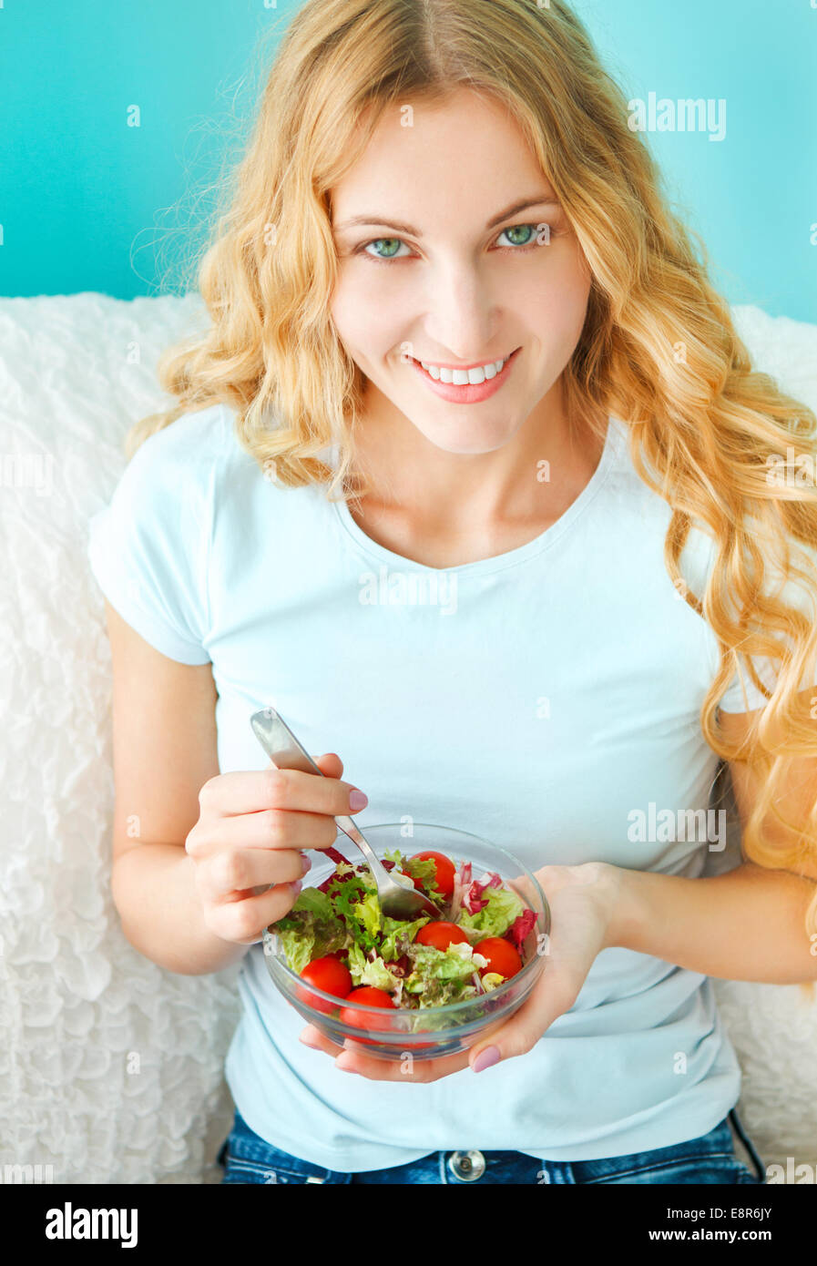 Woman diet concept portrait. Female model eating green salad Stock ...