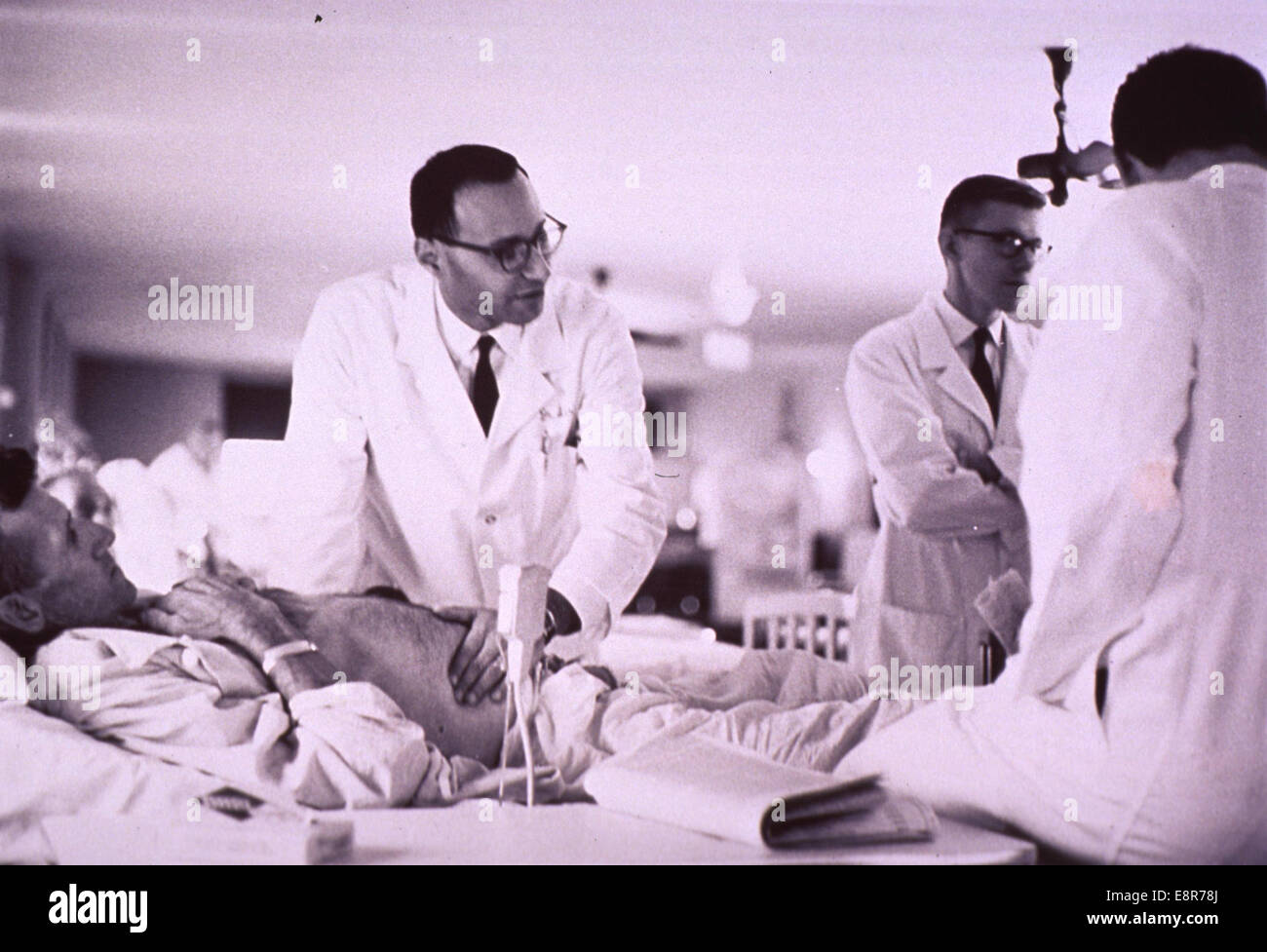 A photograph by Roy Perry showing a physician examining a patient at ...