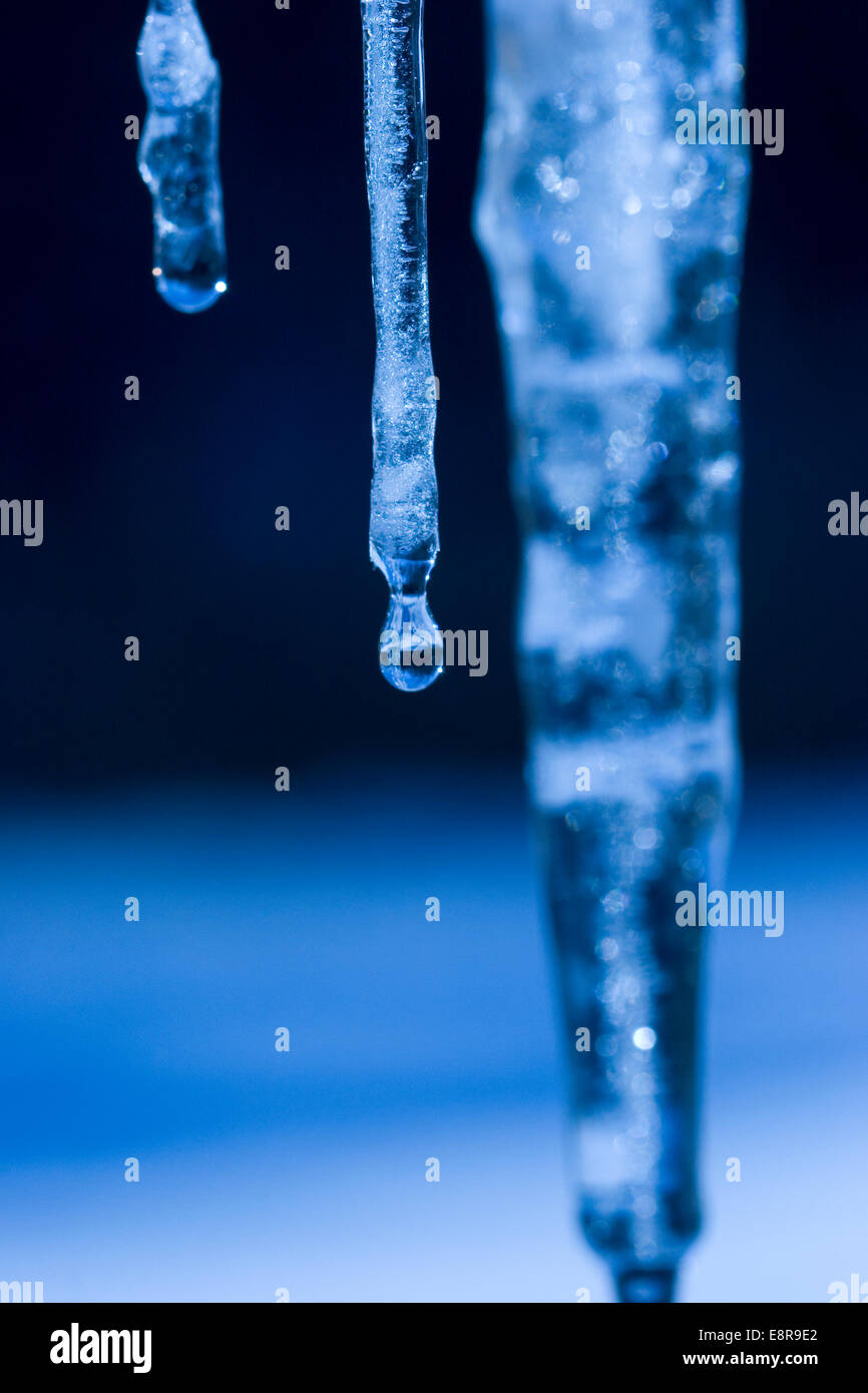 Blue icicles frozen in winter Stock Photo - Alamy