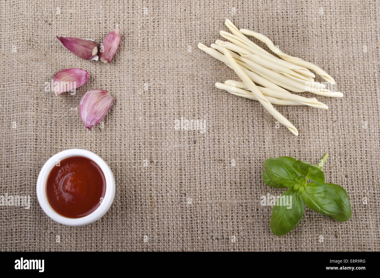 home made pasta, tomato puree, basil and organic garlic Stock Photo - Alamy