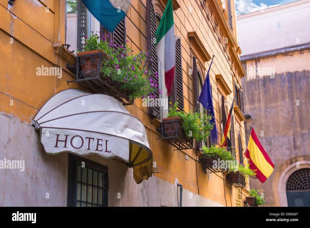 Internationals flags on building of the hotel Stock Photo - Alamy