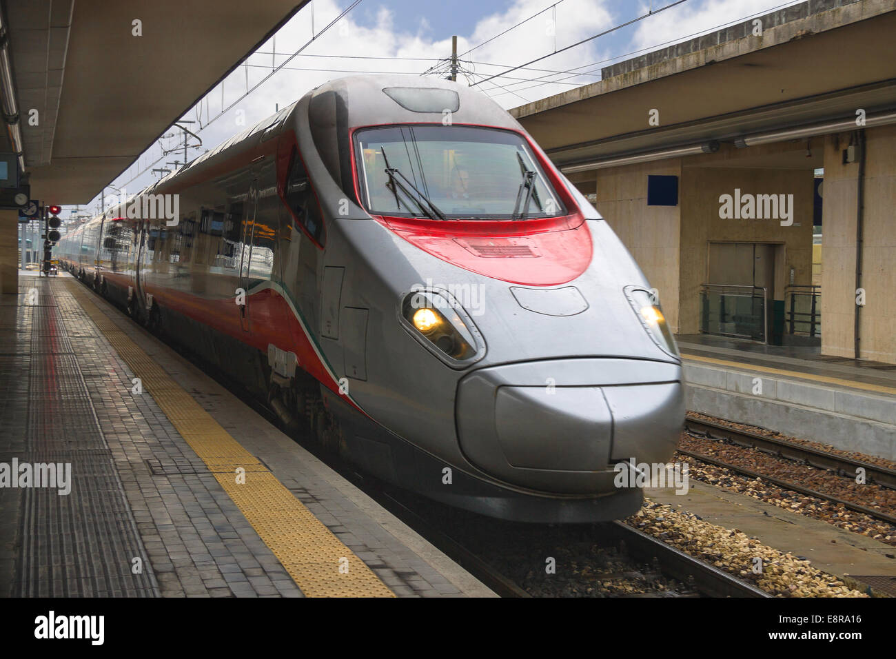 The train stops near the platform station in Italy Stock Photo - Alamy