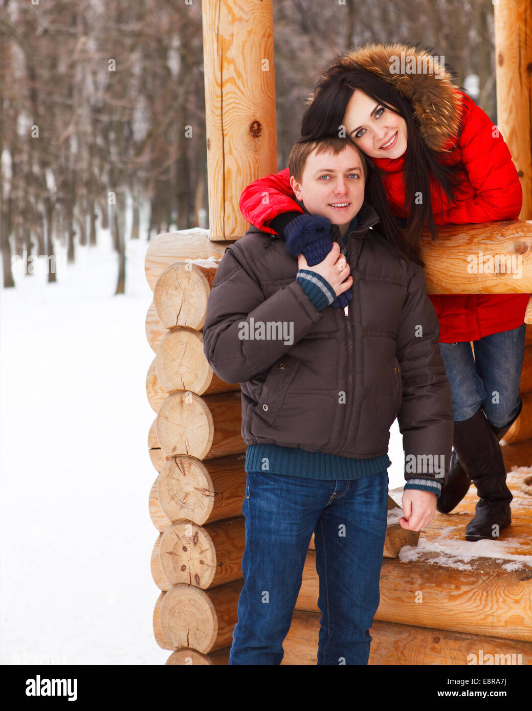 Happy young couple in love having fun in the winter park Stock Photo ...