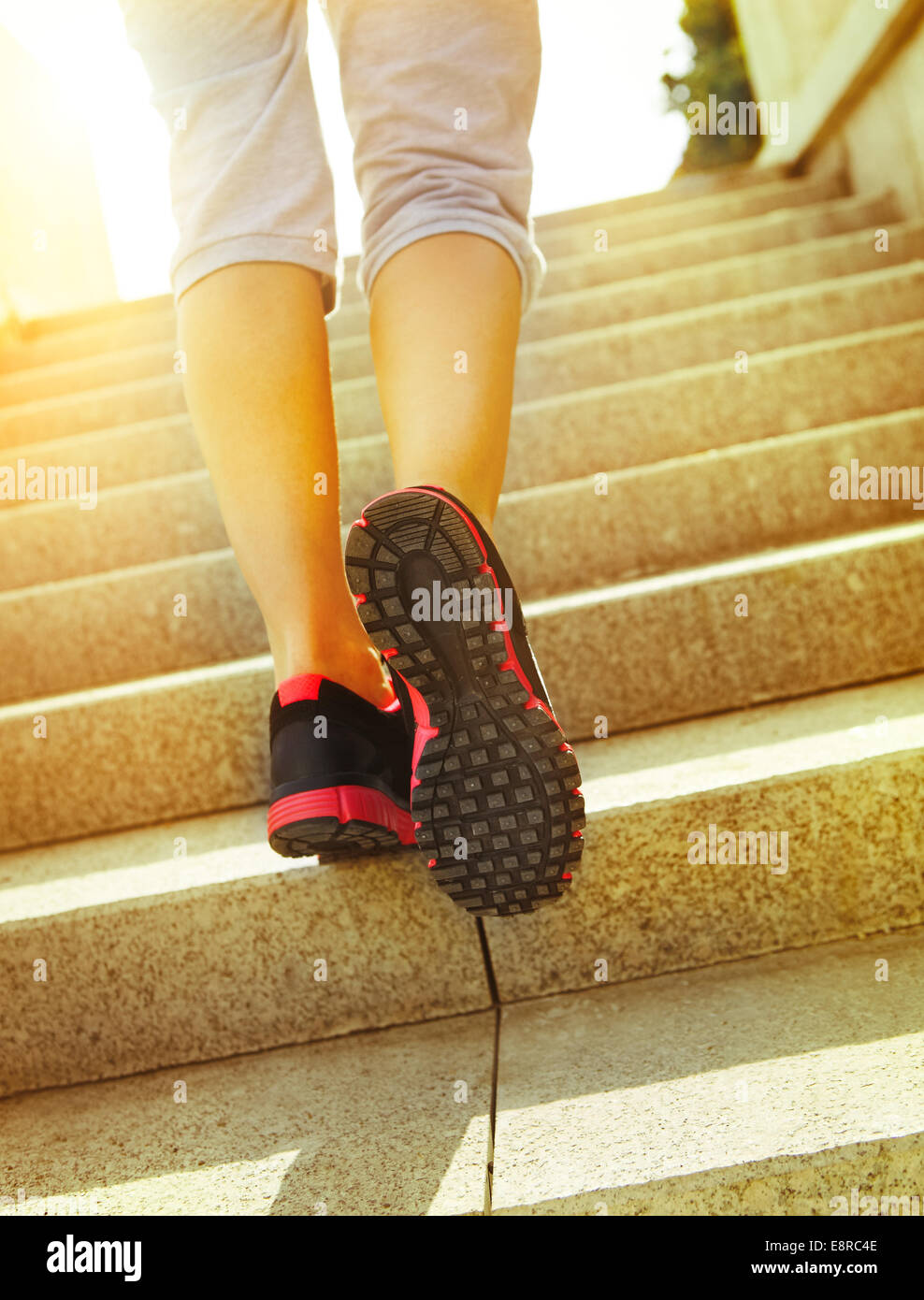 Runner feet running on road closeup on shoes. Woman fitness sunrise jog ...