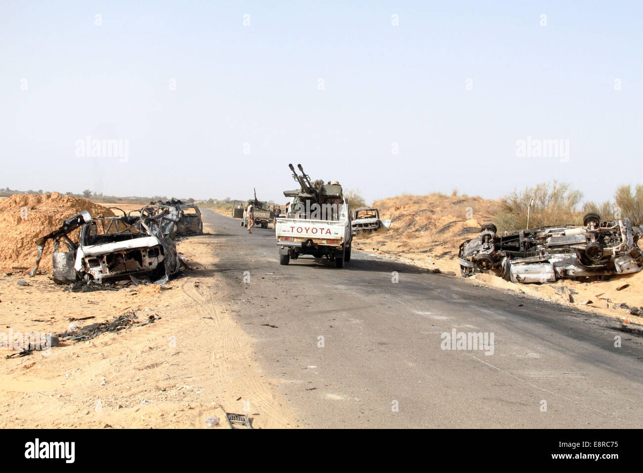 Tripoli, Libya. 13th Oct, 2014. Libya Dawn fighters block a road by ...