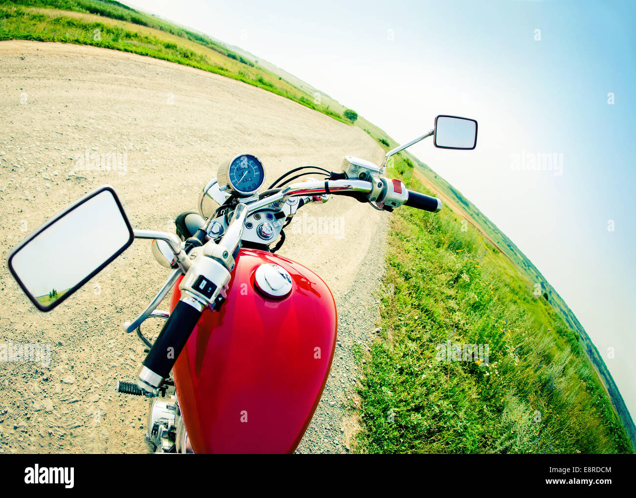 Drivers view of the cockpit in a modern motorcycle on the country road ...