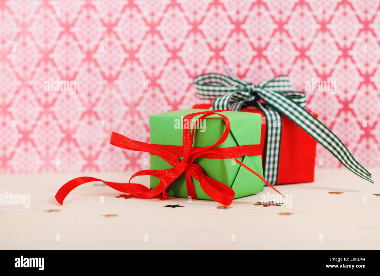 Two christmas presents decorated with ribbon Stock Photo - Alamy