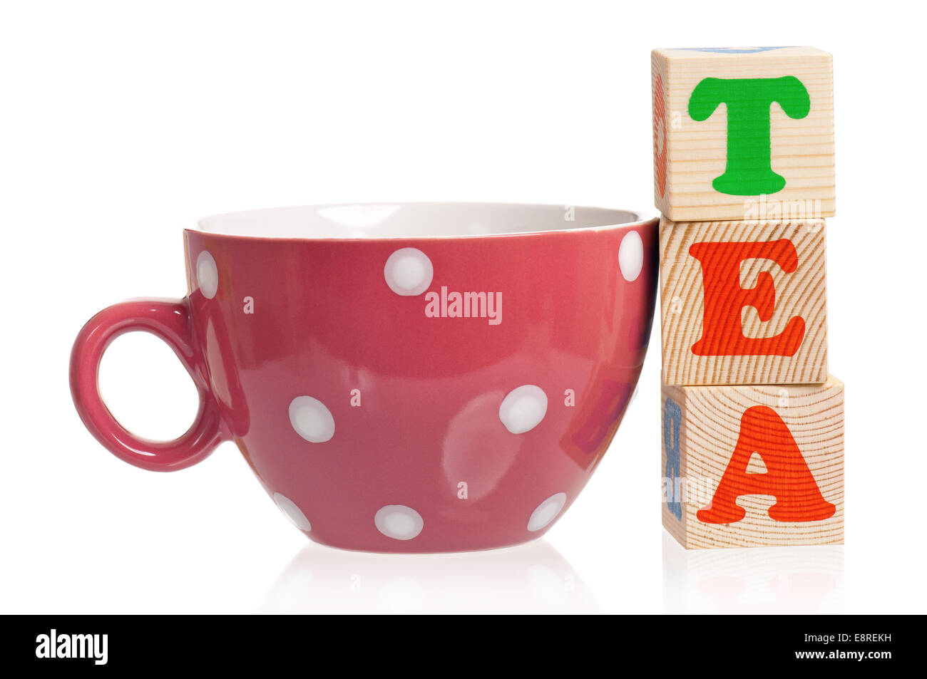 Cup with blocks Stock Photo - Alamy