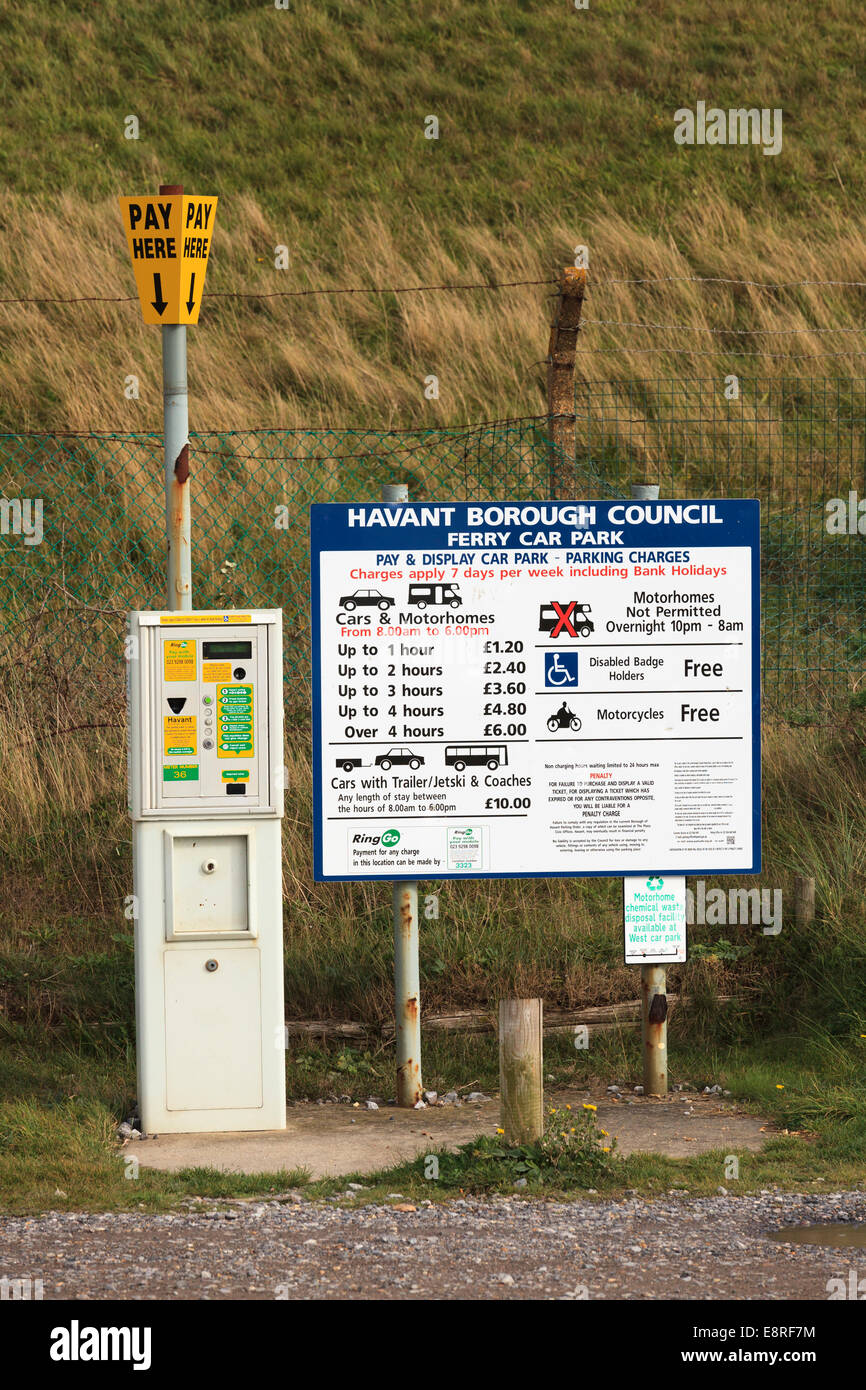 Pay and display car park pay point with charges board Stock Photo - Alamy