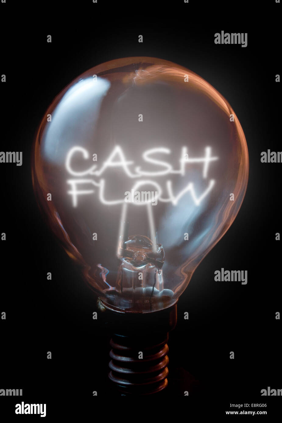 Cash flow illuminated light bulb Stock Photo - Alamy