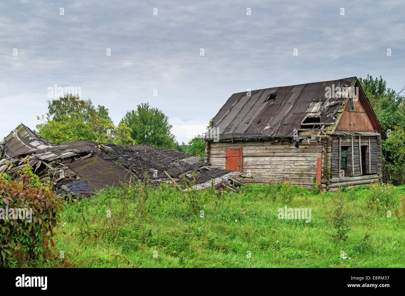 Very old wooden house and barn in village Stock Photo - Alamy