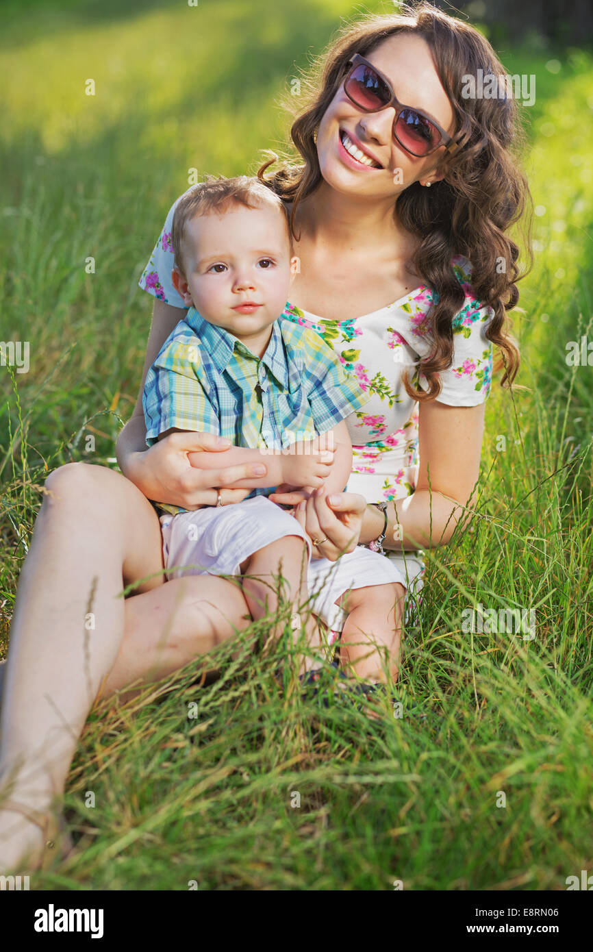 Smiling pretty mother hugging lovely child Stock Photo - Alamy