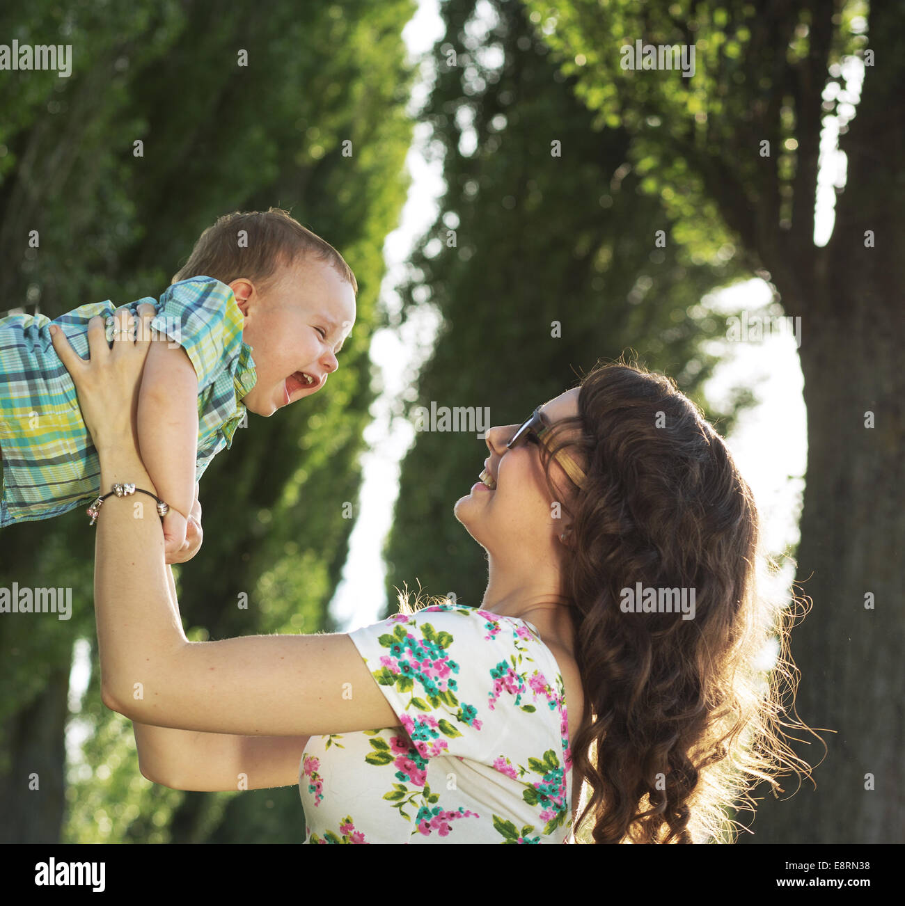 Tender mother playing with her son Stock Photo - Alamy