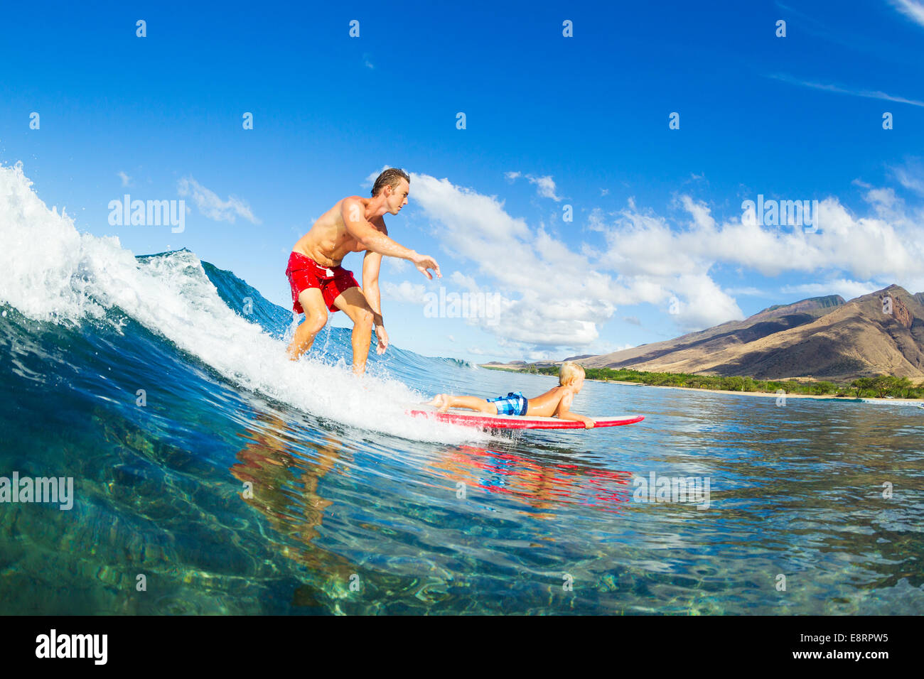 Father and Son Surfing Together. Riding Wave on Surfboard Tandem ...