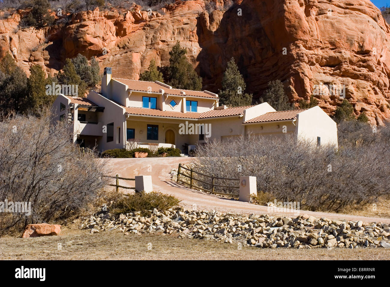 A stucco house amongst red rocks in Perry Park, Colorado Stock Photo ...