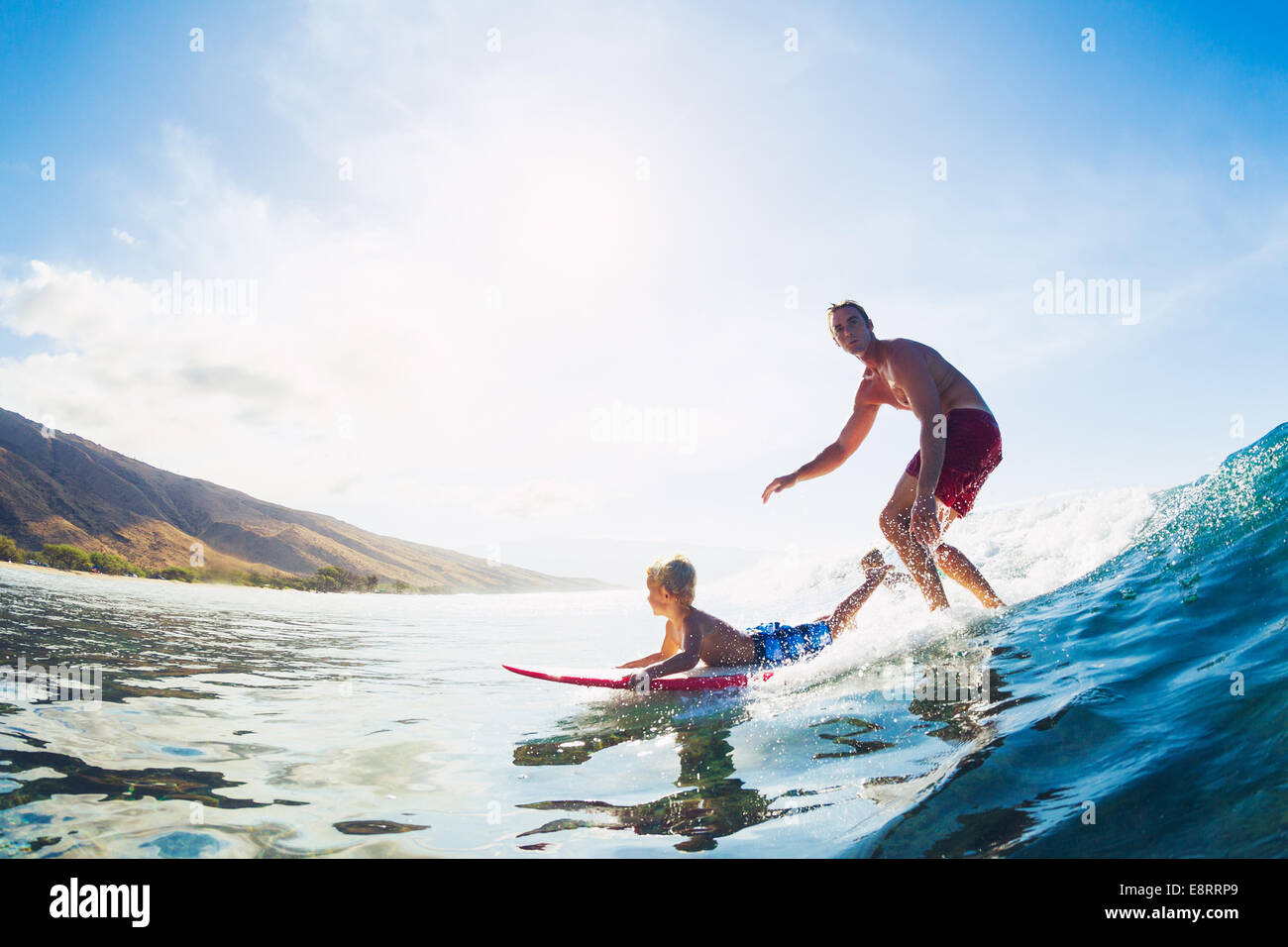 Father and Son Surfing Together Riding Blue Ocean Wave Stock Photo - Alamy