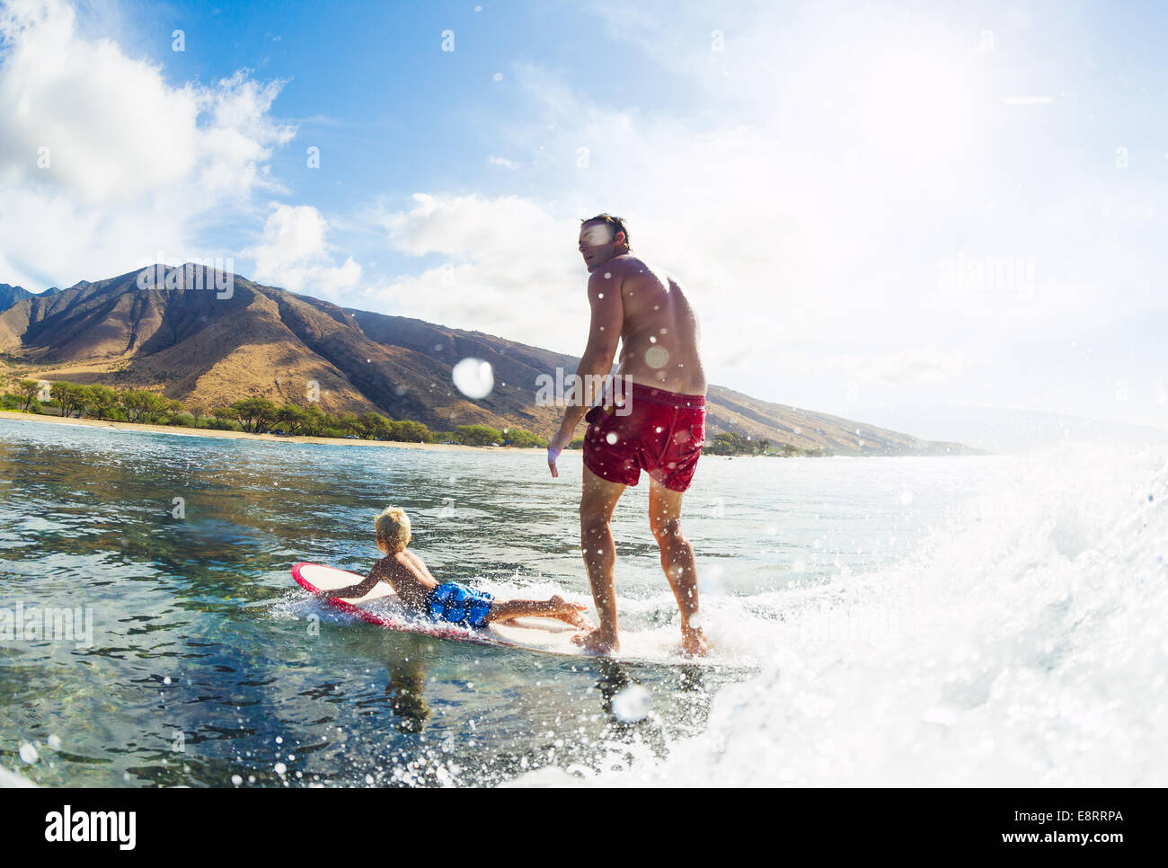 Father and Son Surfing Together. Riding Wave on Surfboard Tandem ...