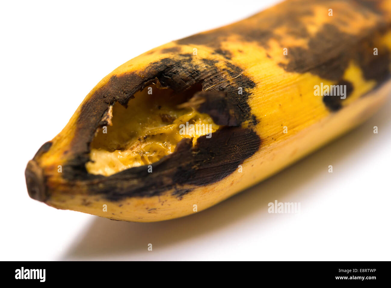 ripe banana bited by insect on white close up Stock Photo - Alamy