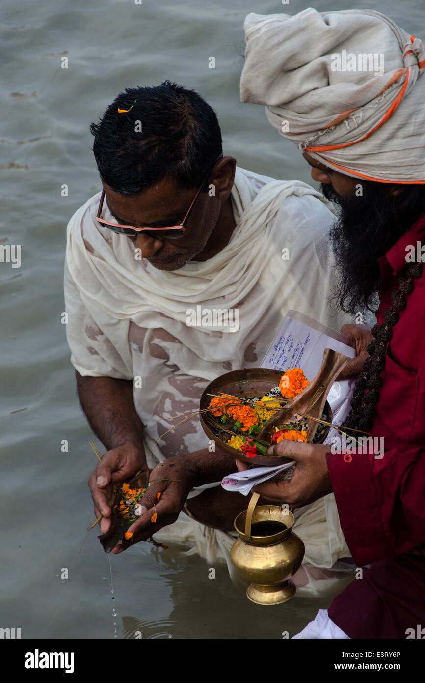 Man offering prayer to ancestor during the day Tarpana, Kolkata, West ...