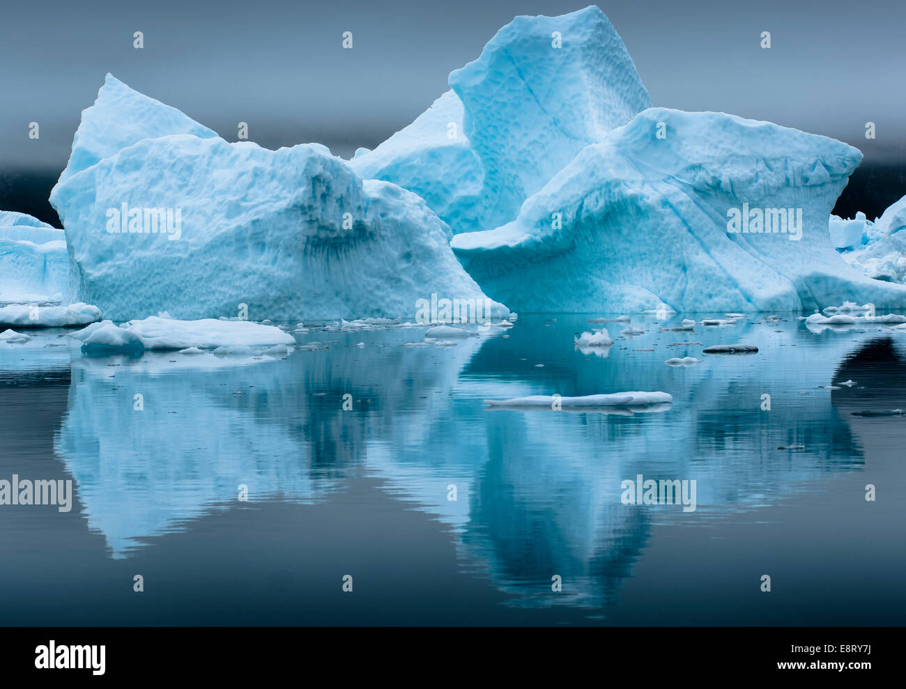 A deep blue iceberg and it's reflection in Narsarsuaq, Greenland Stock ...