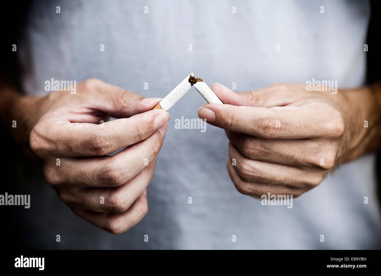 Man trying to quit smoking. Conceptual image. Close-up Stock Photo - Alamy