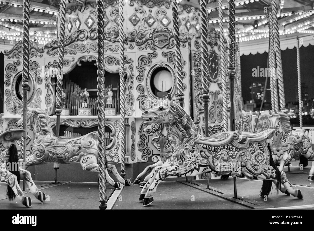 The Brighton Pier fairground at night Stock Photo - Alamy