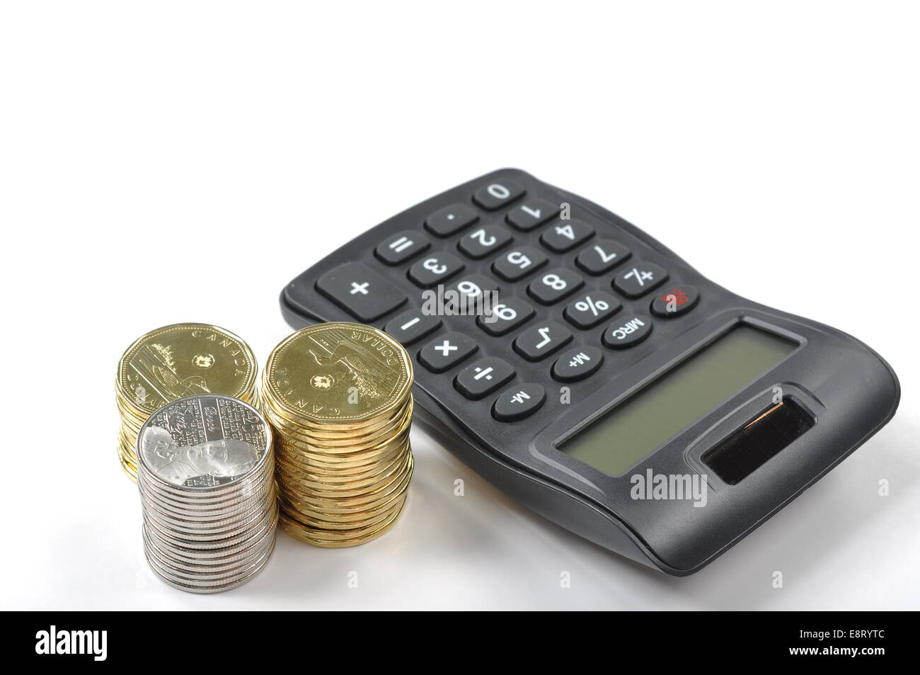 A calculator and money isolated on a white background Stock Photo - Alamy