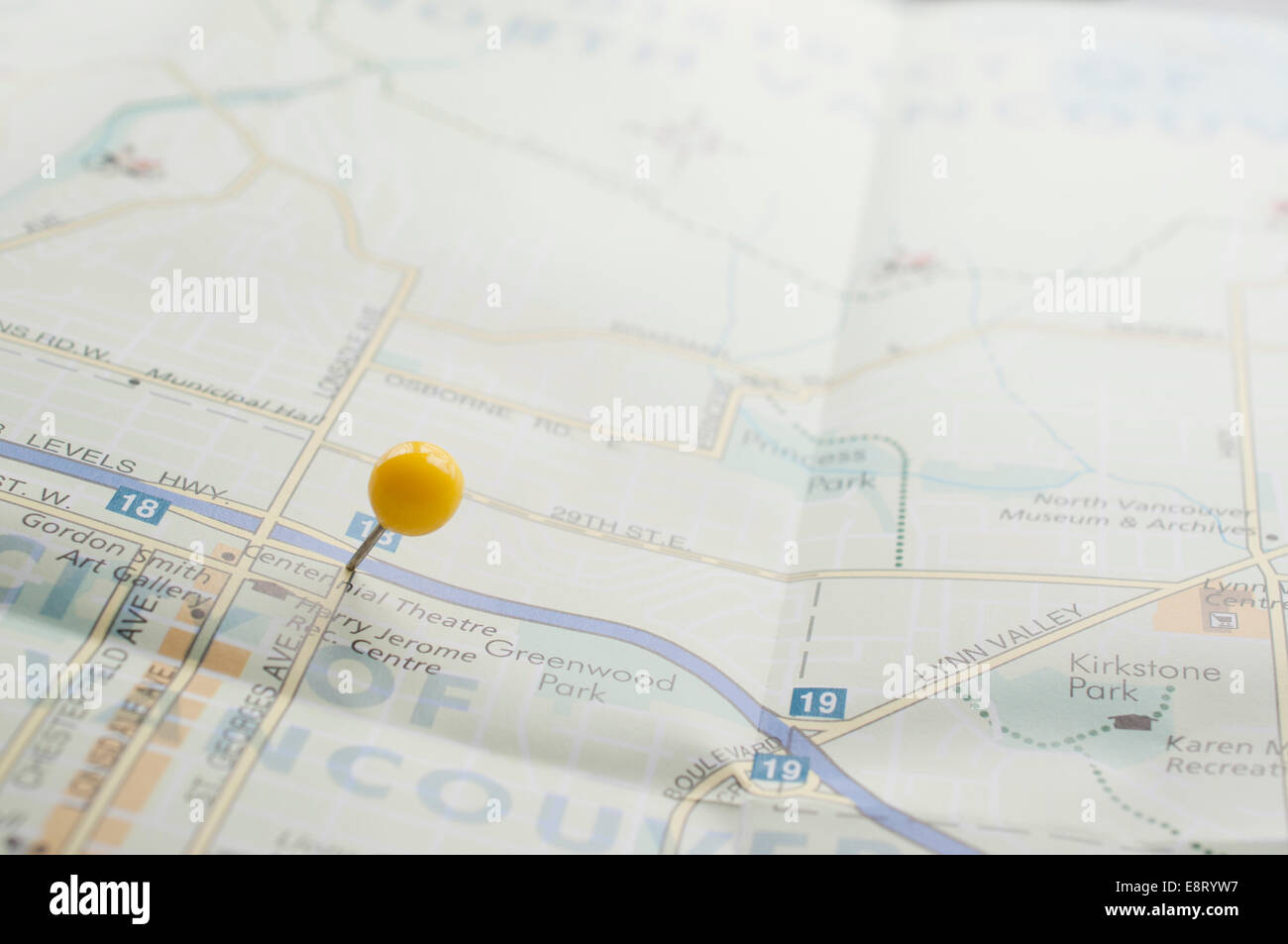 Yellow pin on the map Stock Photo - Alamy
